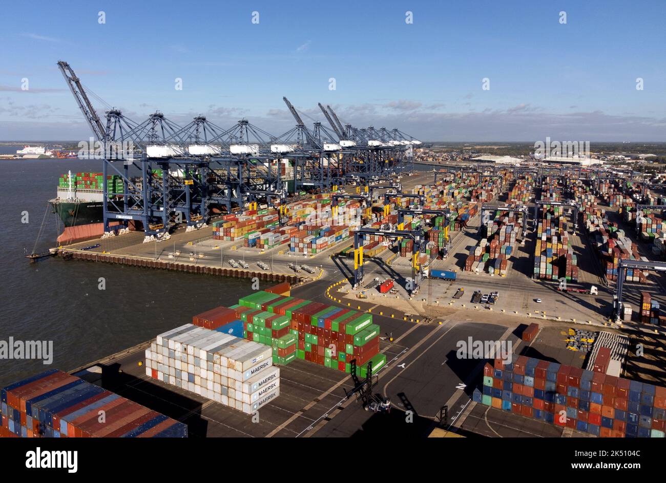Containers are unloaded from cargo ships at the Port of Felixstowe in ...