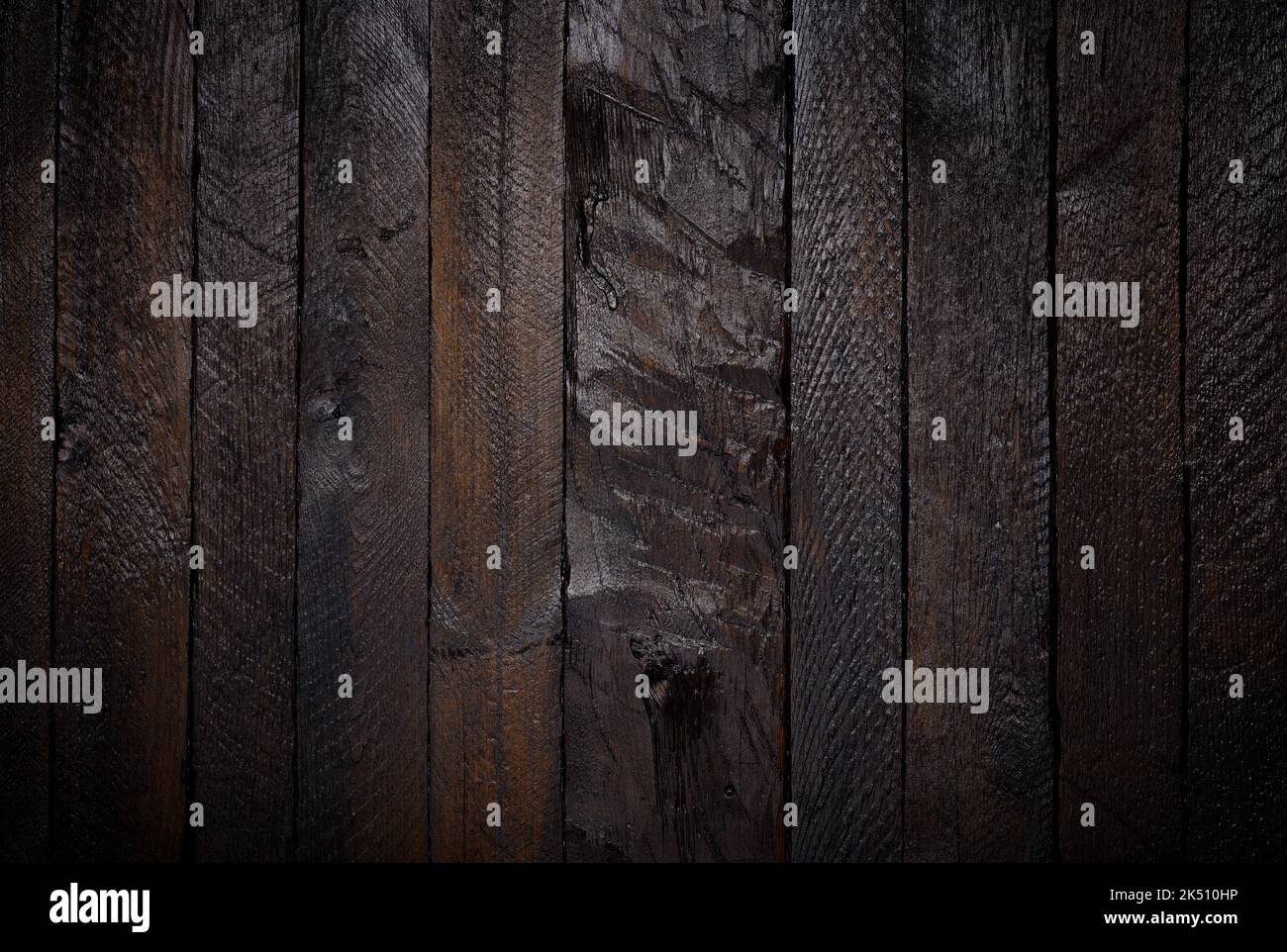 Dark stained rough wooden planks texture background Stock Photo - Alamy