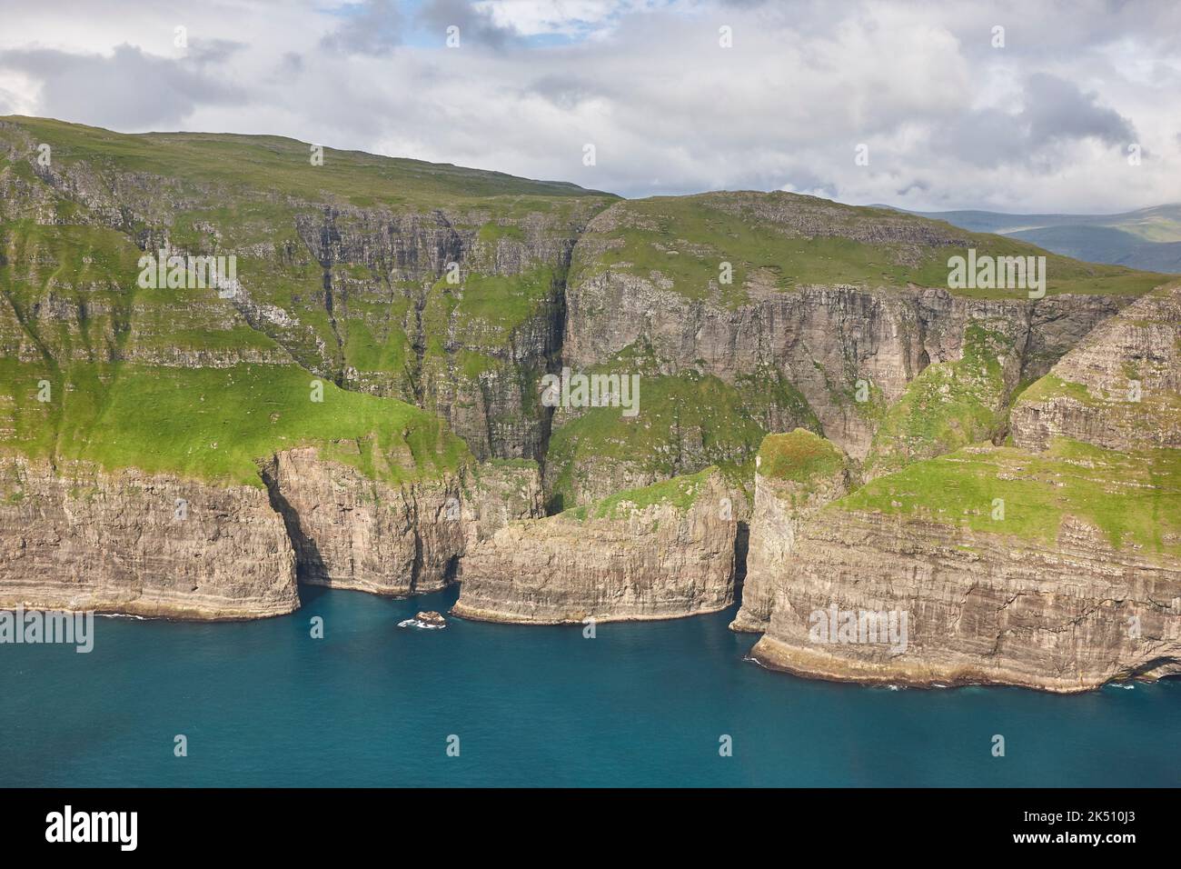 Faroe islands dramatic coastline viewed from helicopter. Vagar area ...