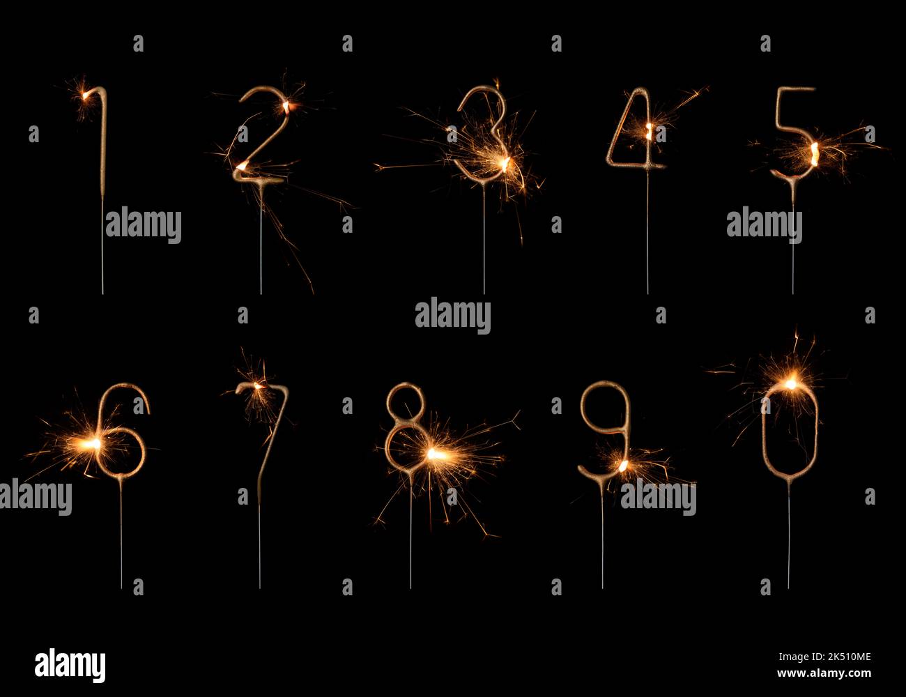 Golden sparklers in numbers digits shape set, burning bright with ...
