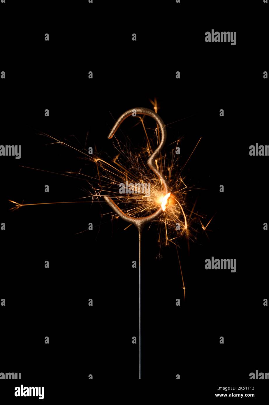 Burning golden sparkler in shape of number three, digit 3, isolated on ...