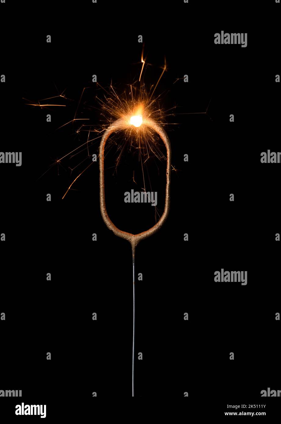 Burning golden sparkler in shape of number zero, digit 0, isolated on ...