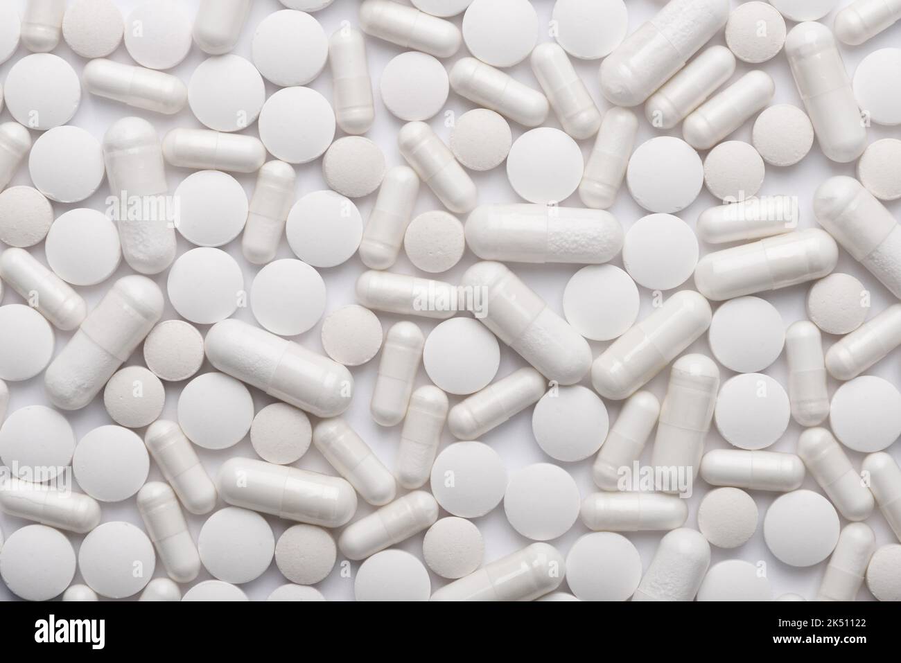 White medication and supplements pills and capsules assortment ...