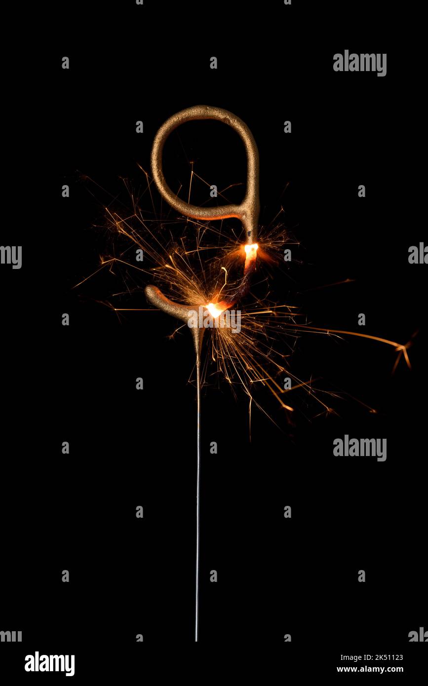 Burning golden sparkler in shape of number nine, digit 9, isolated on ...