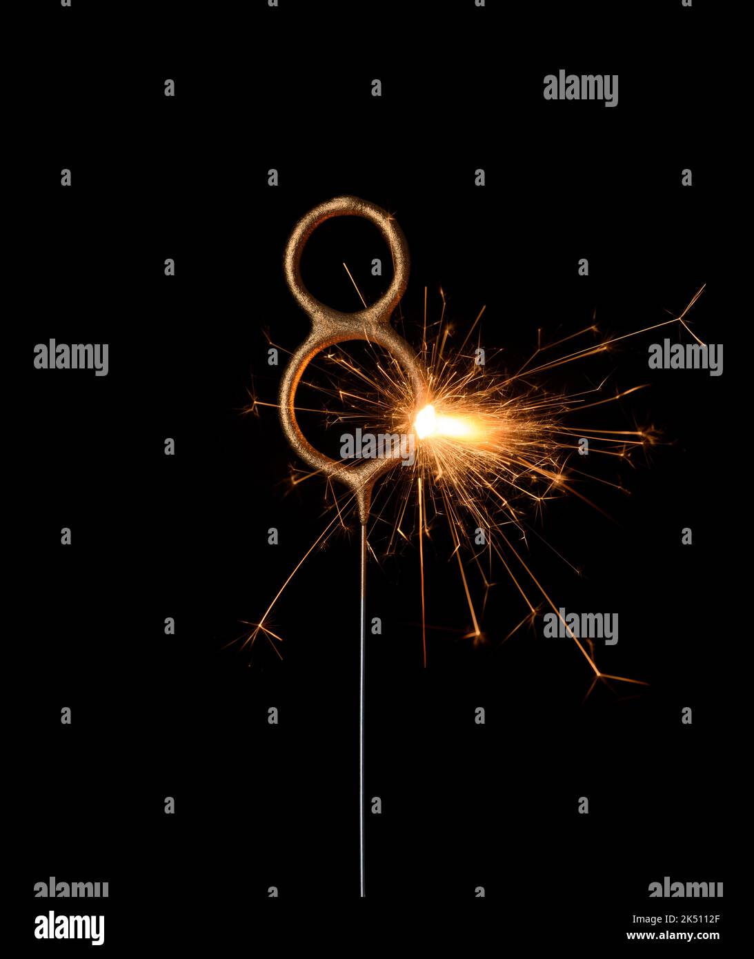 Burning golden sparkler in shape of number eight, digit 8, isolated on ...