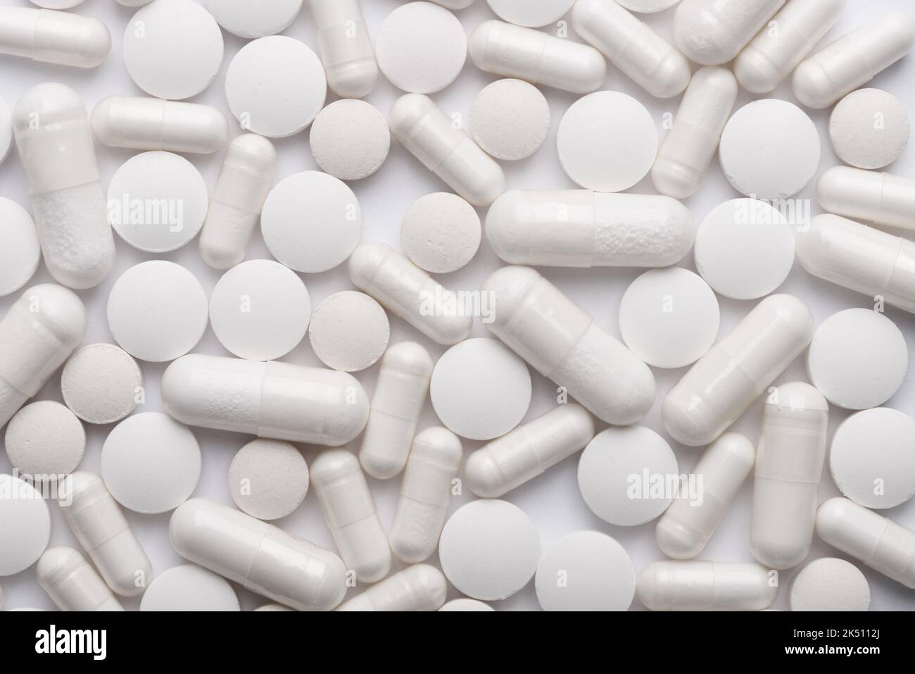 White medication and supplements drugs pills and capsules assortment ...