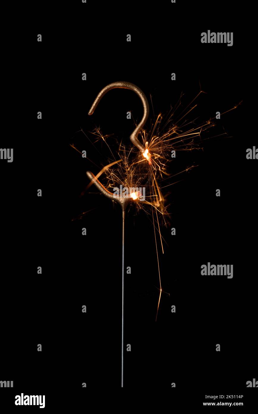 Burning golden sparkler in shape of number three, digit 3, isolated on ...