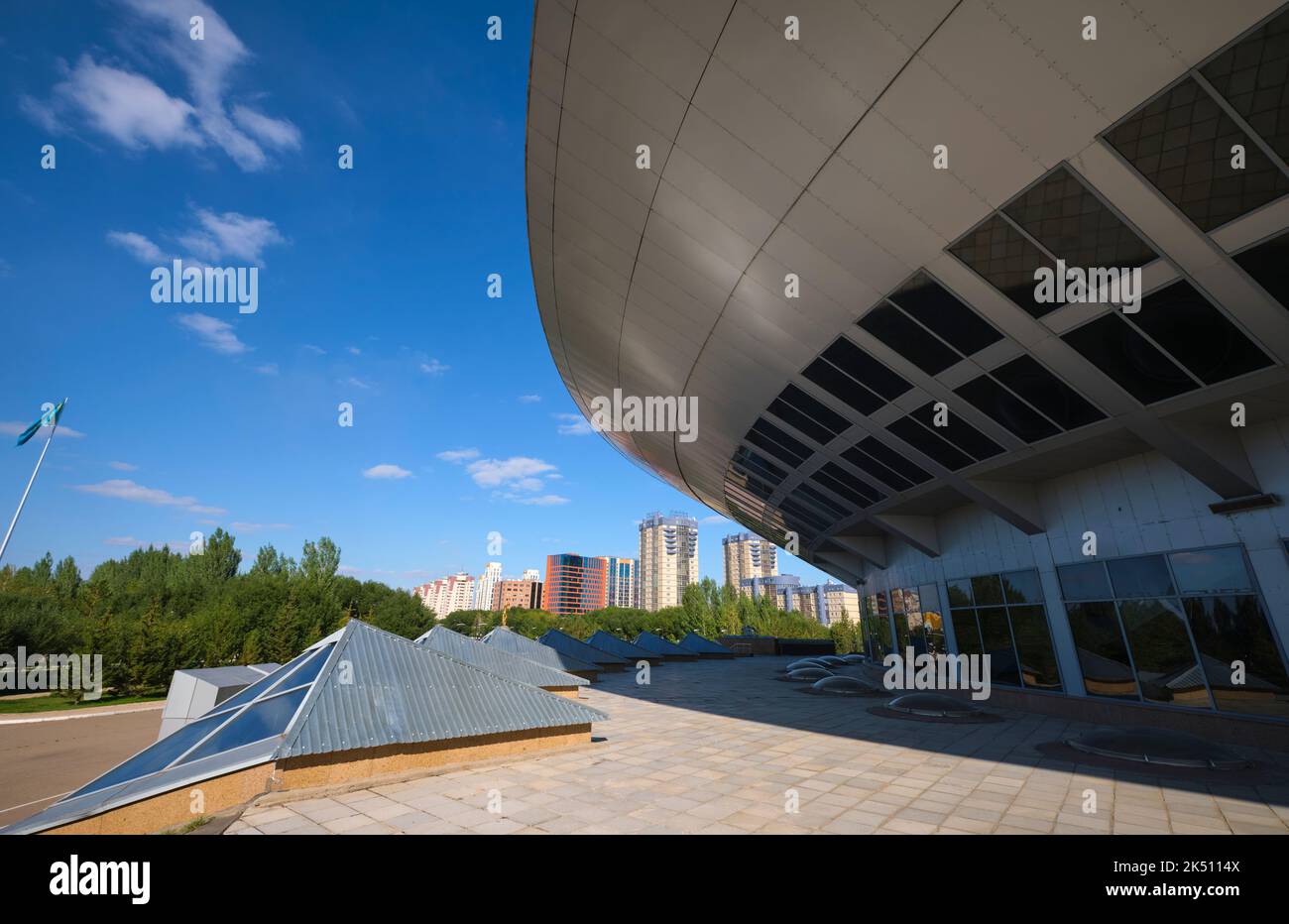 Exterior view of the round, circular, silver, shiny, modern, flying ...