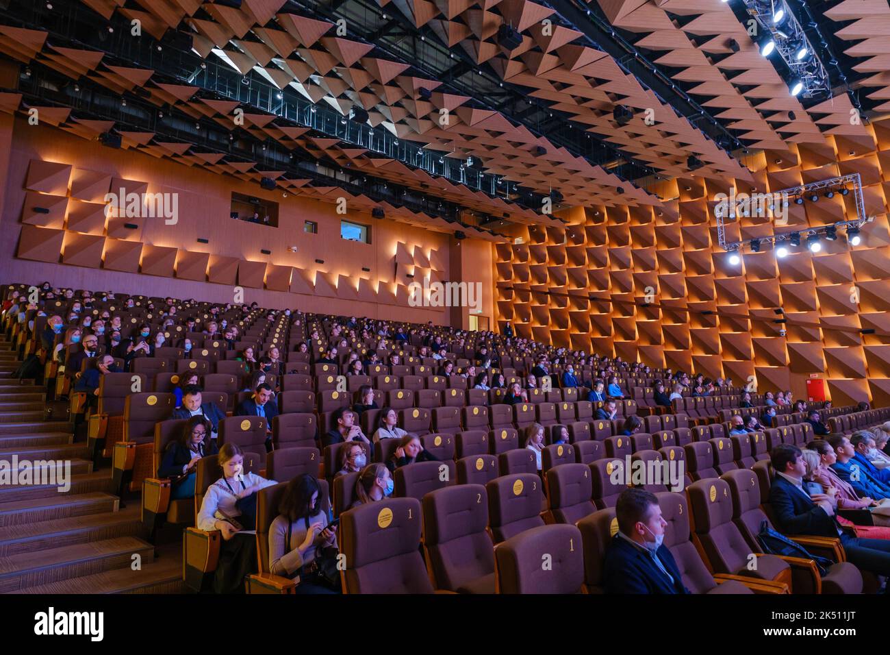 People in half empty auditorium during seminar Stock Photo - Alamy