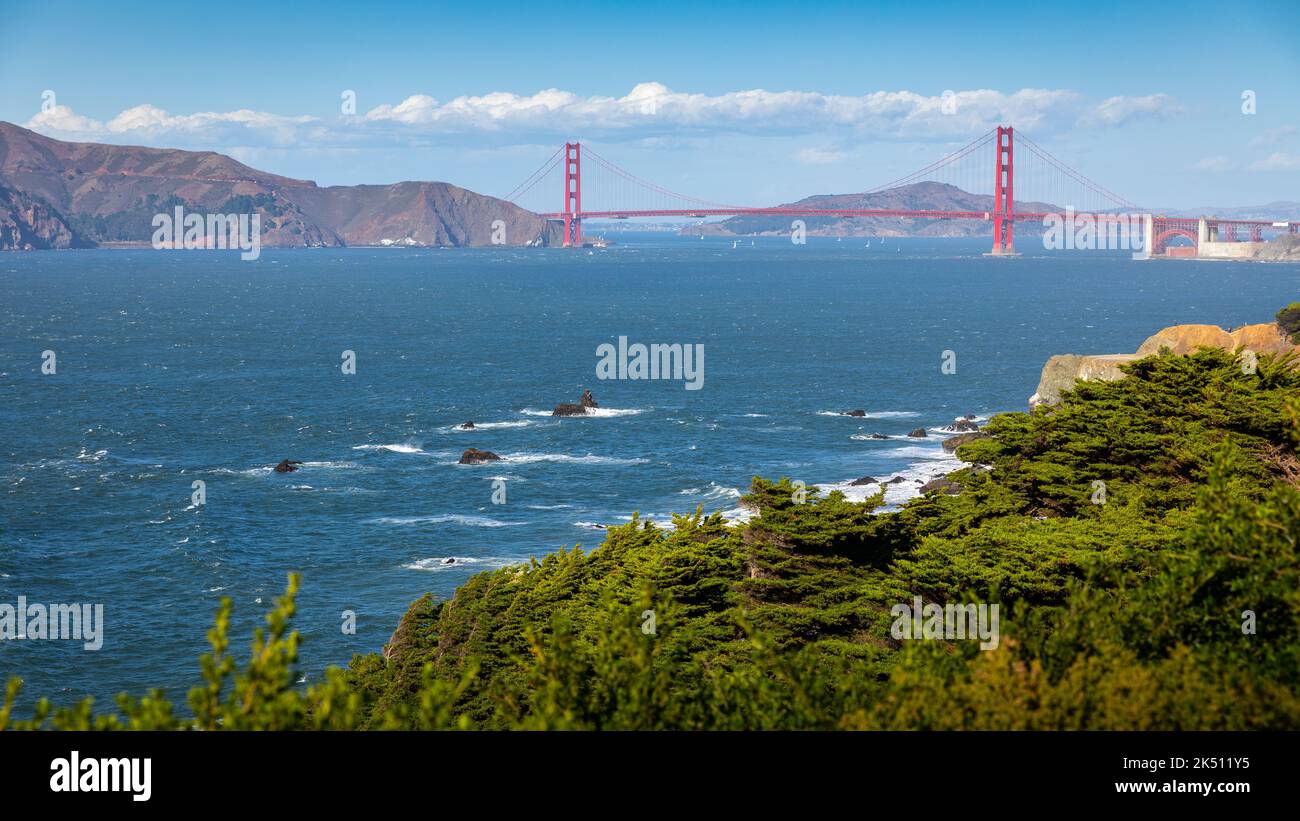 Landscape of Golden Gate bridge over sea horizon from Baker beach, San ...