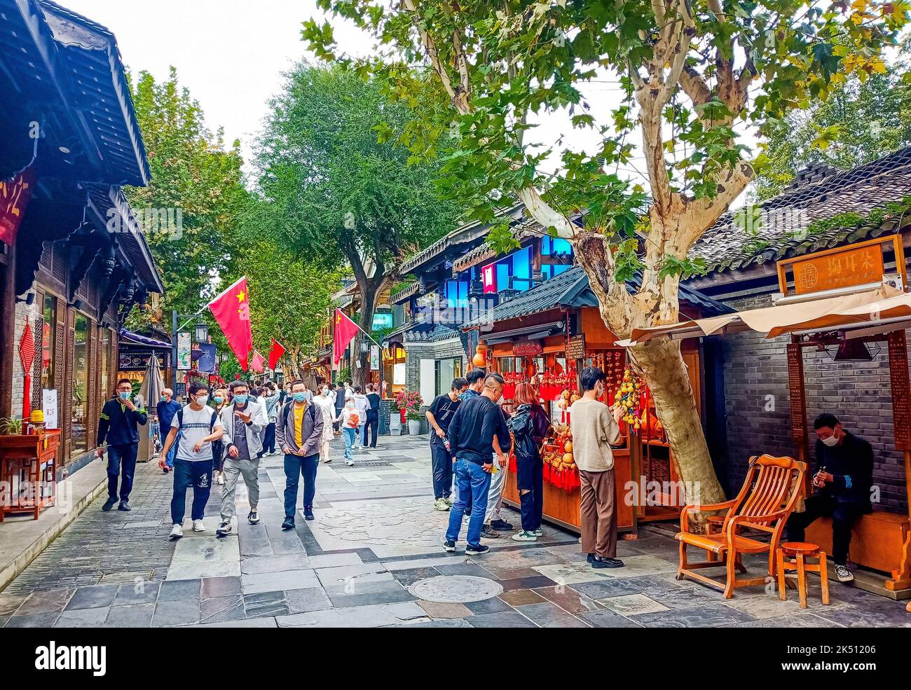 CHENGDU, CHINA - OCTOBER 5, 2022 - Tourists take a tour in Kuanzhai ...