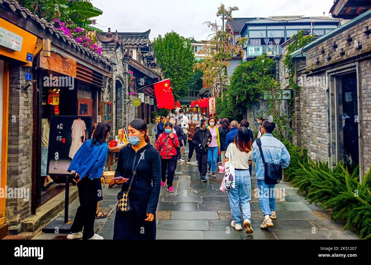 CHENGDU, CHINA - OCTOBER 5, 2022 - Tourists take a tour in Kuanzhai ...