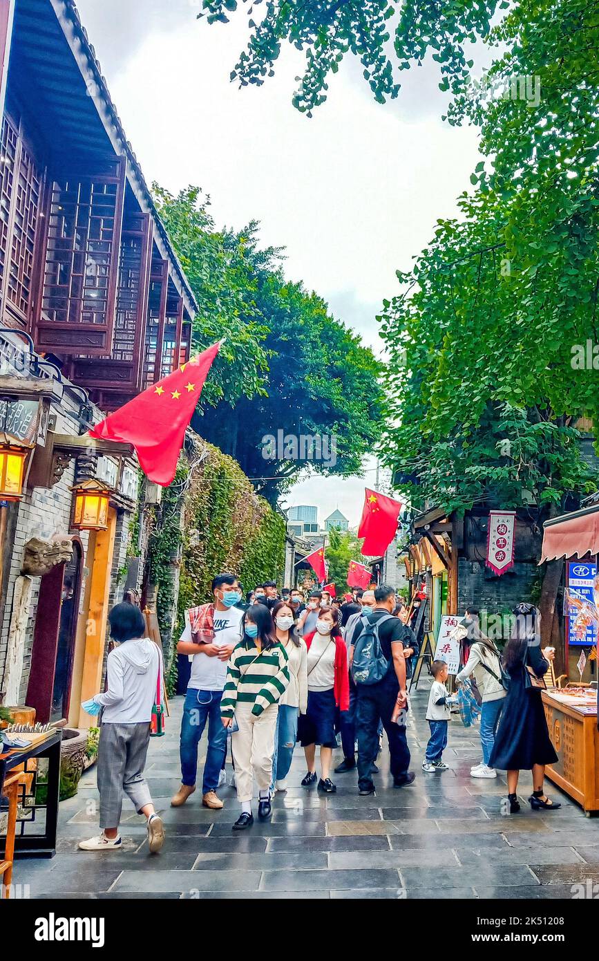 CHENGDU, CHINA - OCTOBER 5, 2022 - Tourists take a tour in Kuanzhai ...