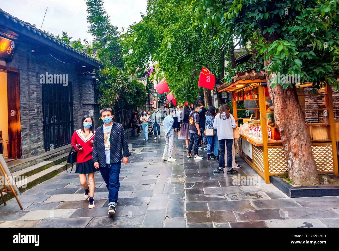 CHENGDU, CHINA - OCTOBER 5, 2022 - Tourists take a tour in Kuanzhai ...