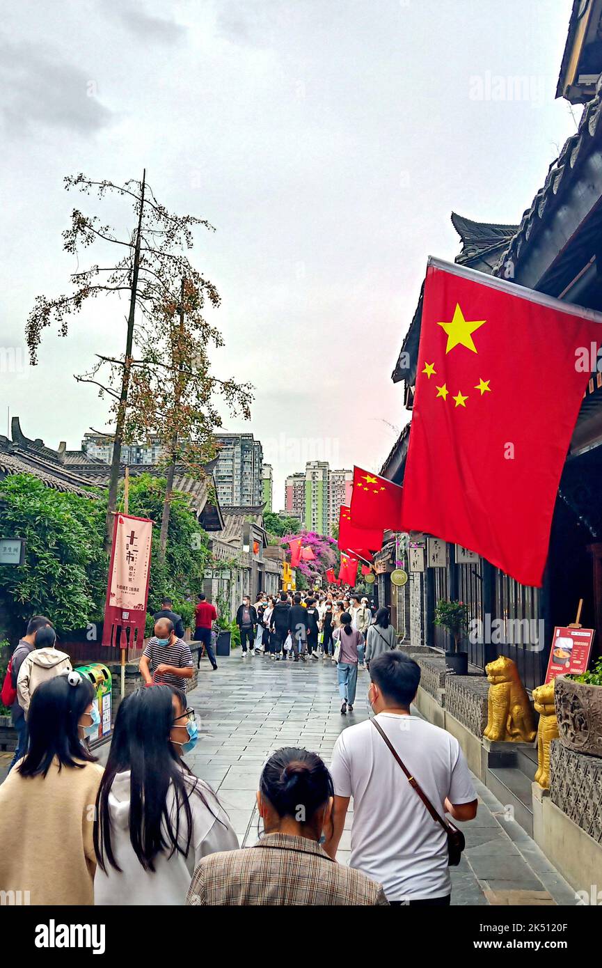 CHENGDU, CHINA - OCTOBER 5, 2022 - Tourists take a tour in Kuanzhai ...