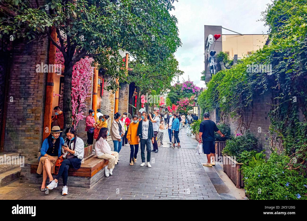 CHENGDU, CHINA - OCTOBER 5, 2022 - Tourists take a tour in Kuanzhai ...
