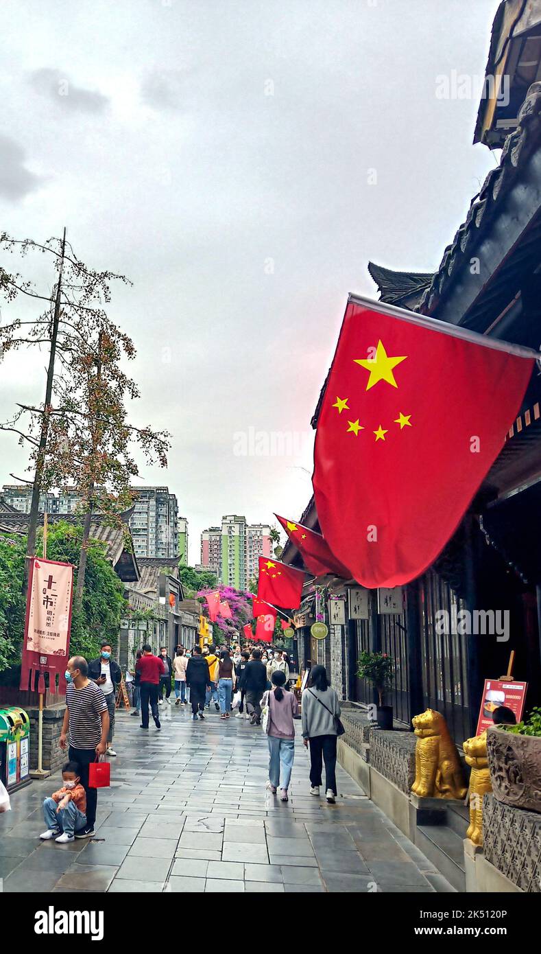 CHENGDU, CHINA - OCTOBER 5, 2022 - Tourists take a tour in Kuanzhai ...