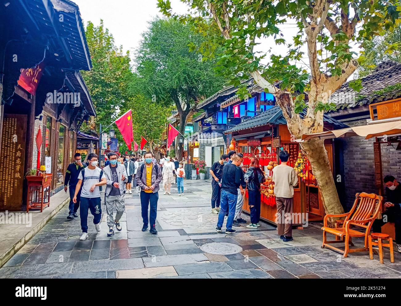 CHENGDU, CHINA - OCTOBER 5, 2022 - Tourists take a tour in Kuanzhai ...