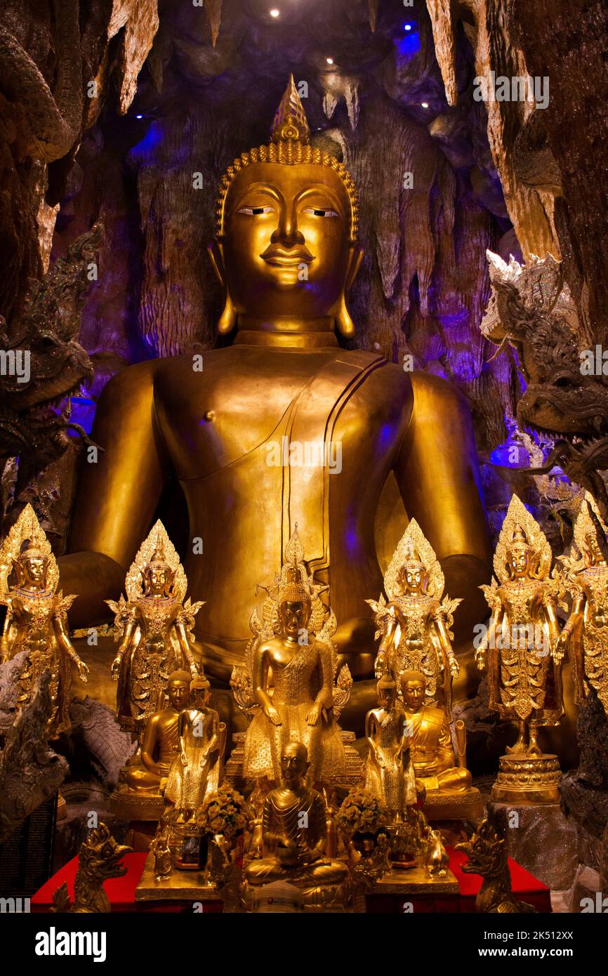 Golden buddha image statue and naga guardian of Wat Maniwong for thai ...