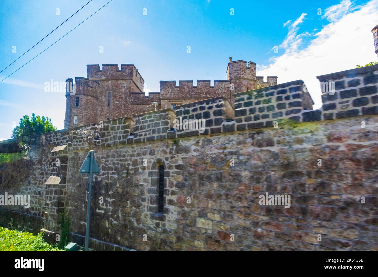 Street view with Banwell Castle in Banwell village,Somerset, United ...