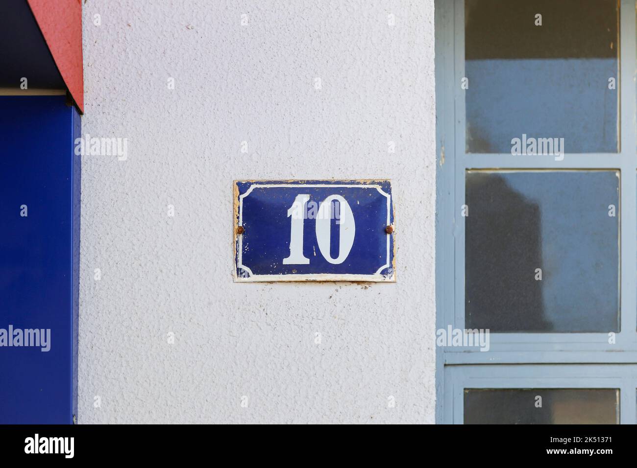 number ten in metallic plate format, with copy space and blue and white ...
