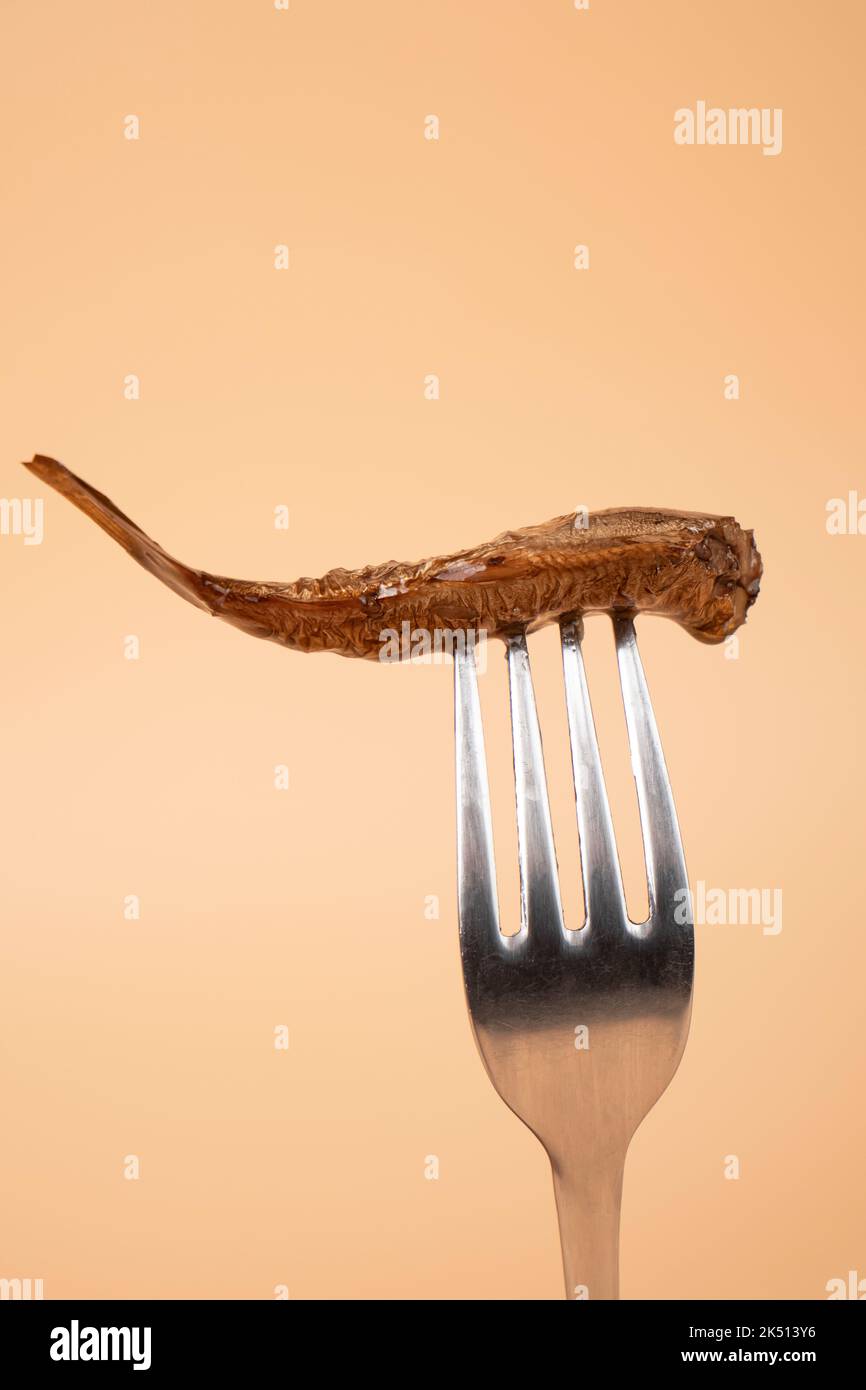sprat in oil on a fork closeup,small fish delicacie Stock Photo - Alamy