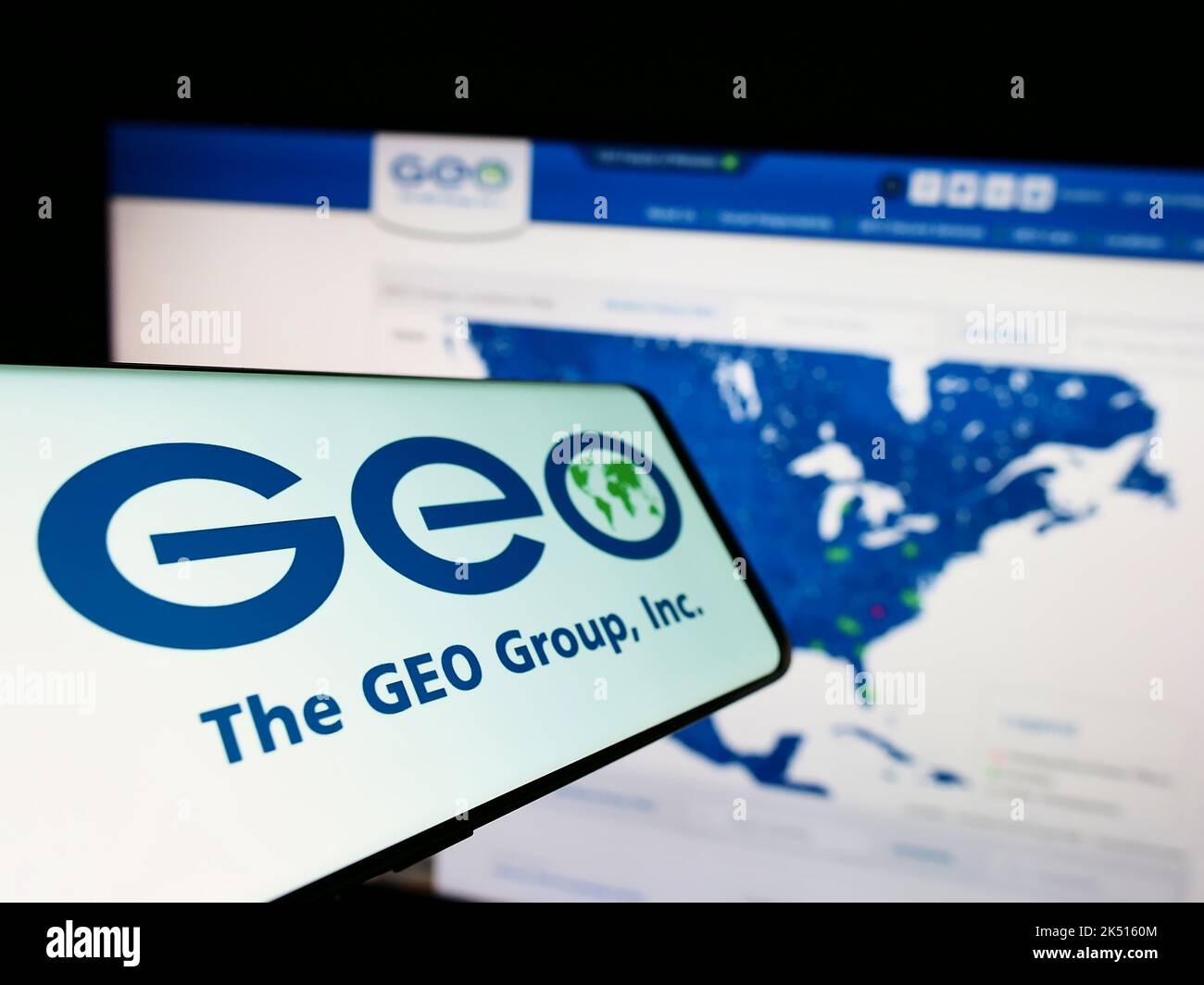 Mobile phone with logo of American security company The GEO Group Inc ...