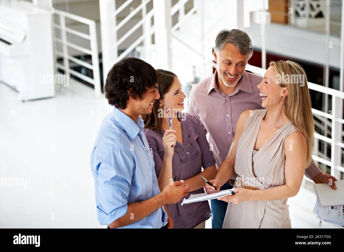 Teamwork to get the best result. A dynamic business team going over a ...
