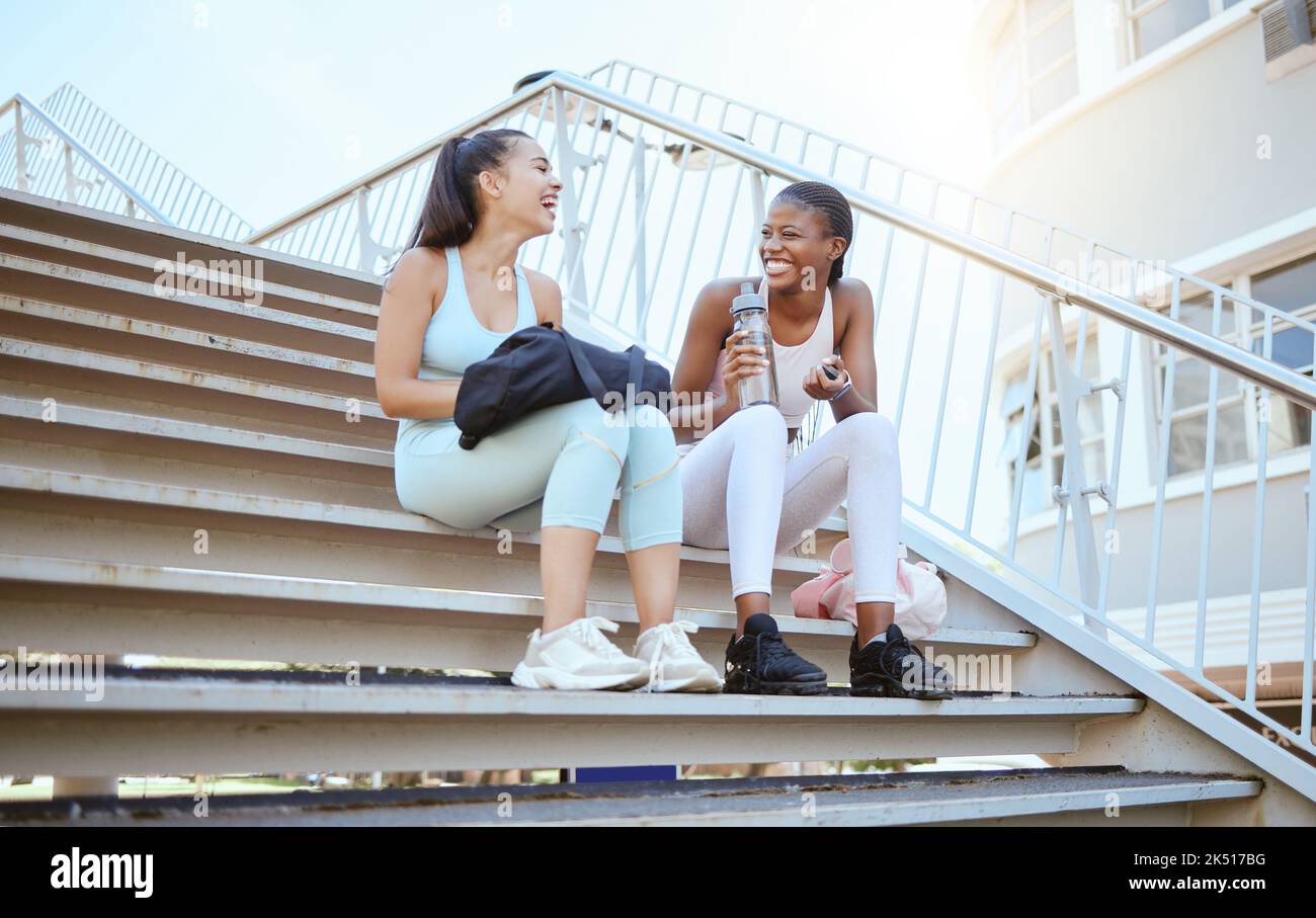 City fitness, relax and friends on stairs after running for cardio with ...