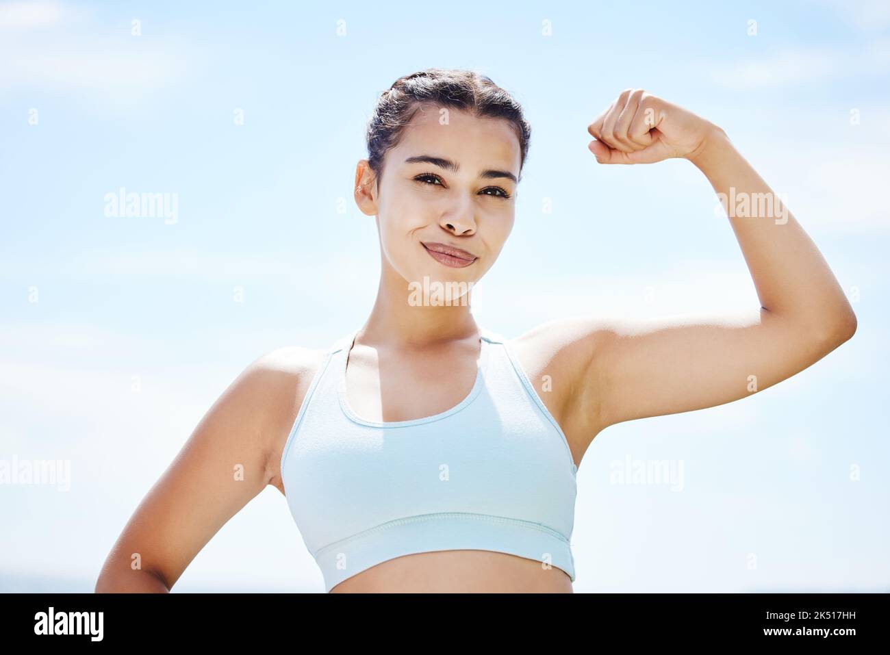 Strong woman flexing arms, body and muscle power, fitness and wellness ...