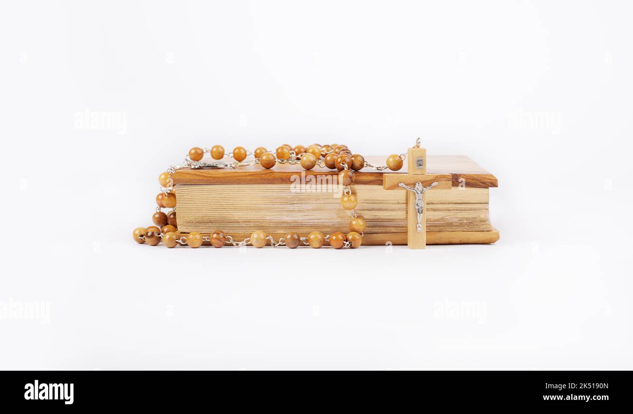 Wooden Bible from Jerusalem with rosary isolated on white background ...