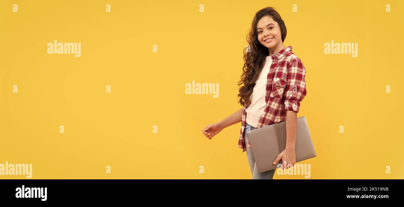 E-learning is a better way of learning. Happy girl child carry laptop ...