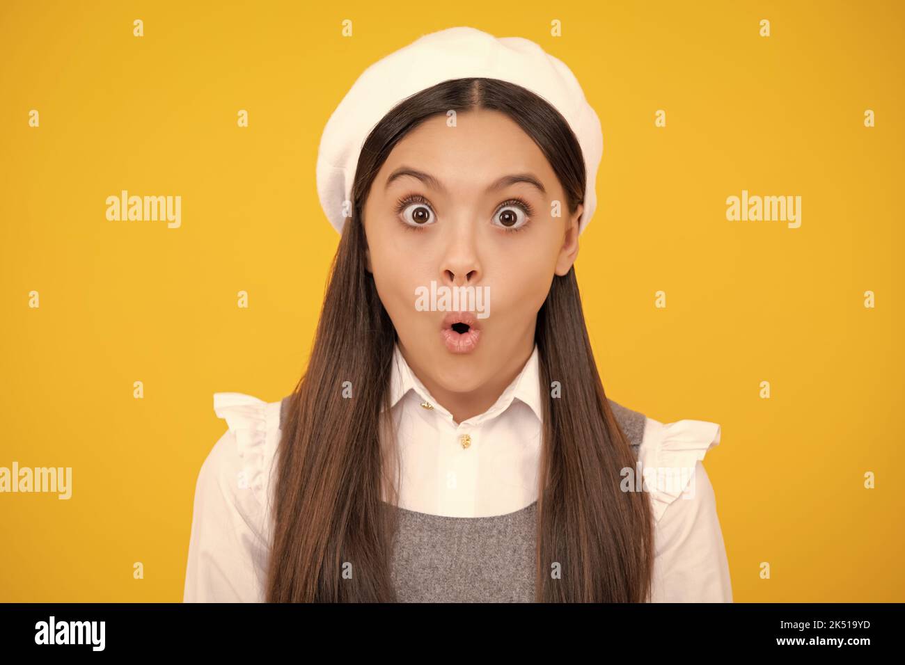 Shocked teenager child portrait isolated on yellow background ...