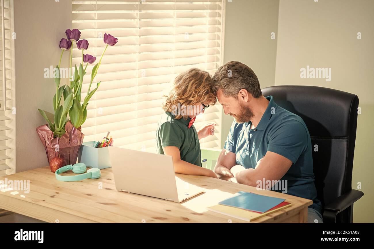 friendship. father and son in glasses use computer. family blog. nerd ...