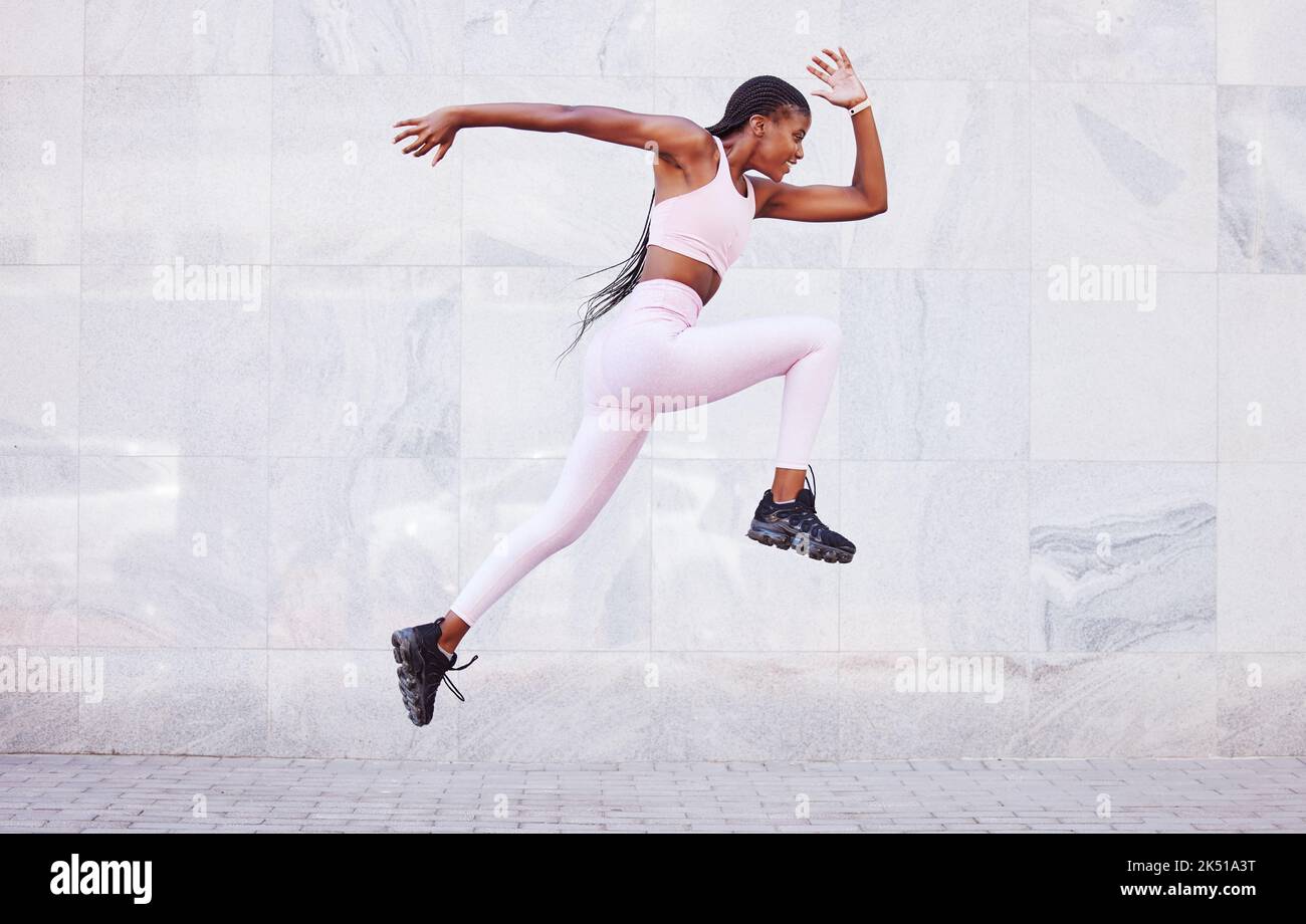 Energy, sports and black woman jump running outdoor for fitness ...