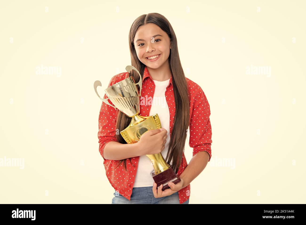 Teenager girl with win cup. Teen holding a trophy. Kid winner child won ...