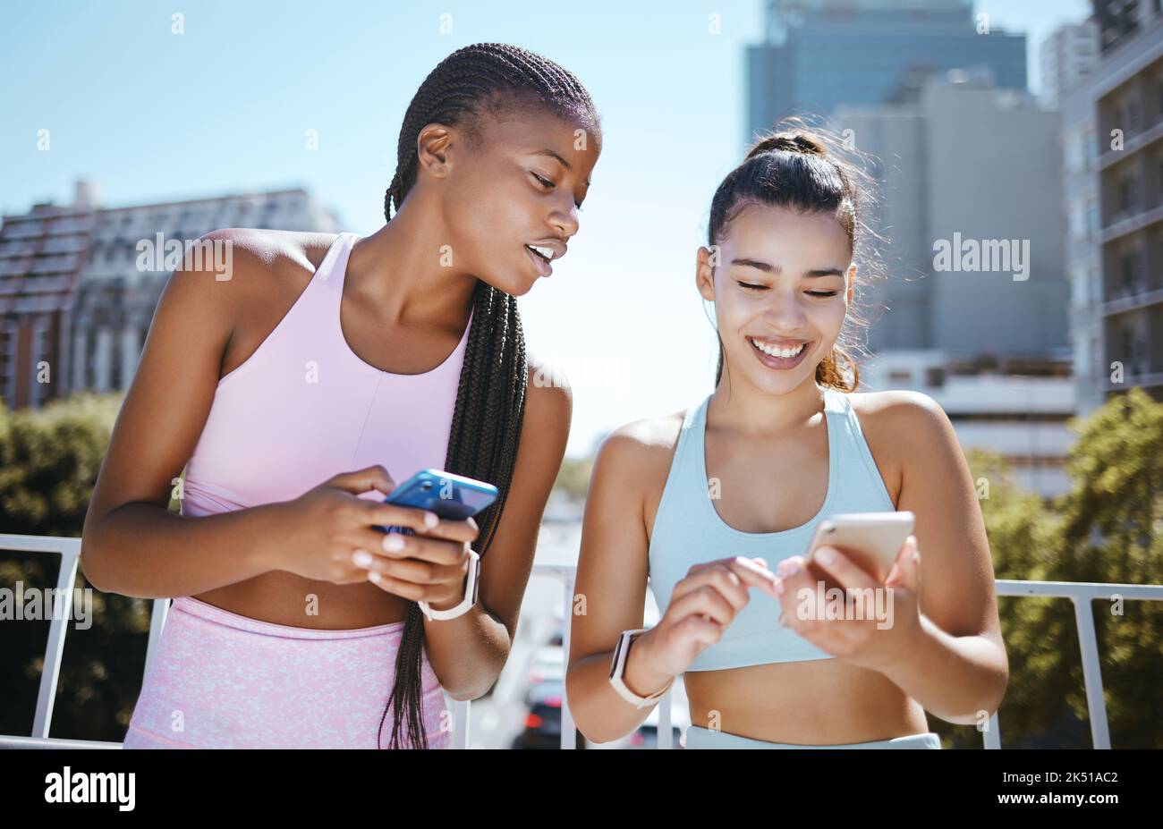 Friends, phone and laughing during exercise for social media, blog or ...