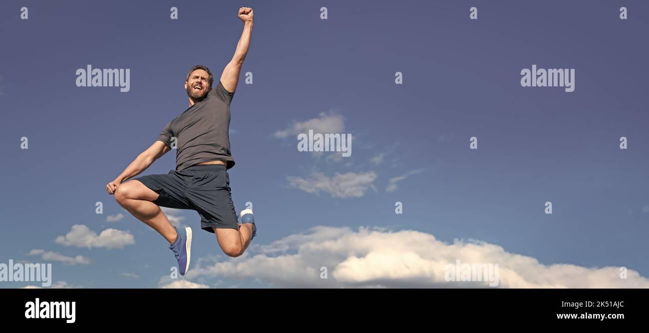 Man running and jumping, banner with copy space. muscular man jumping ...