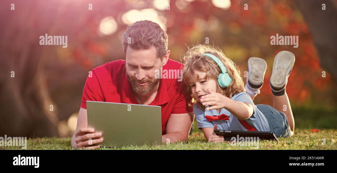 Banner of father on son school boy with laptop study online lying on ...