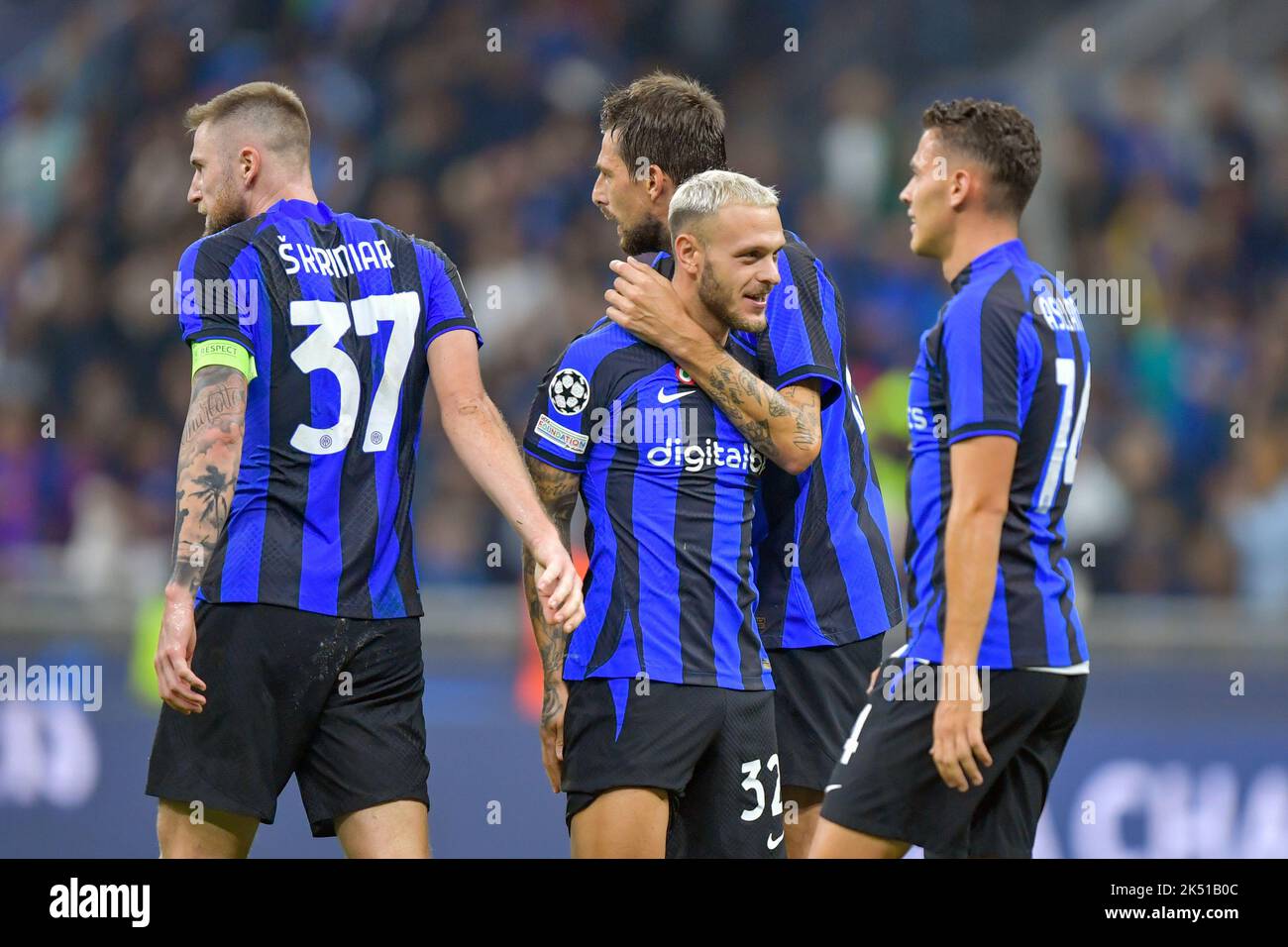 Milano, Italy. 04th Oct, 2022. Federico Dimarco (32), Milan Skriniar (37) and Francesco Acerbi ...