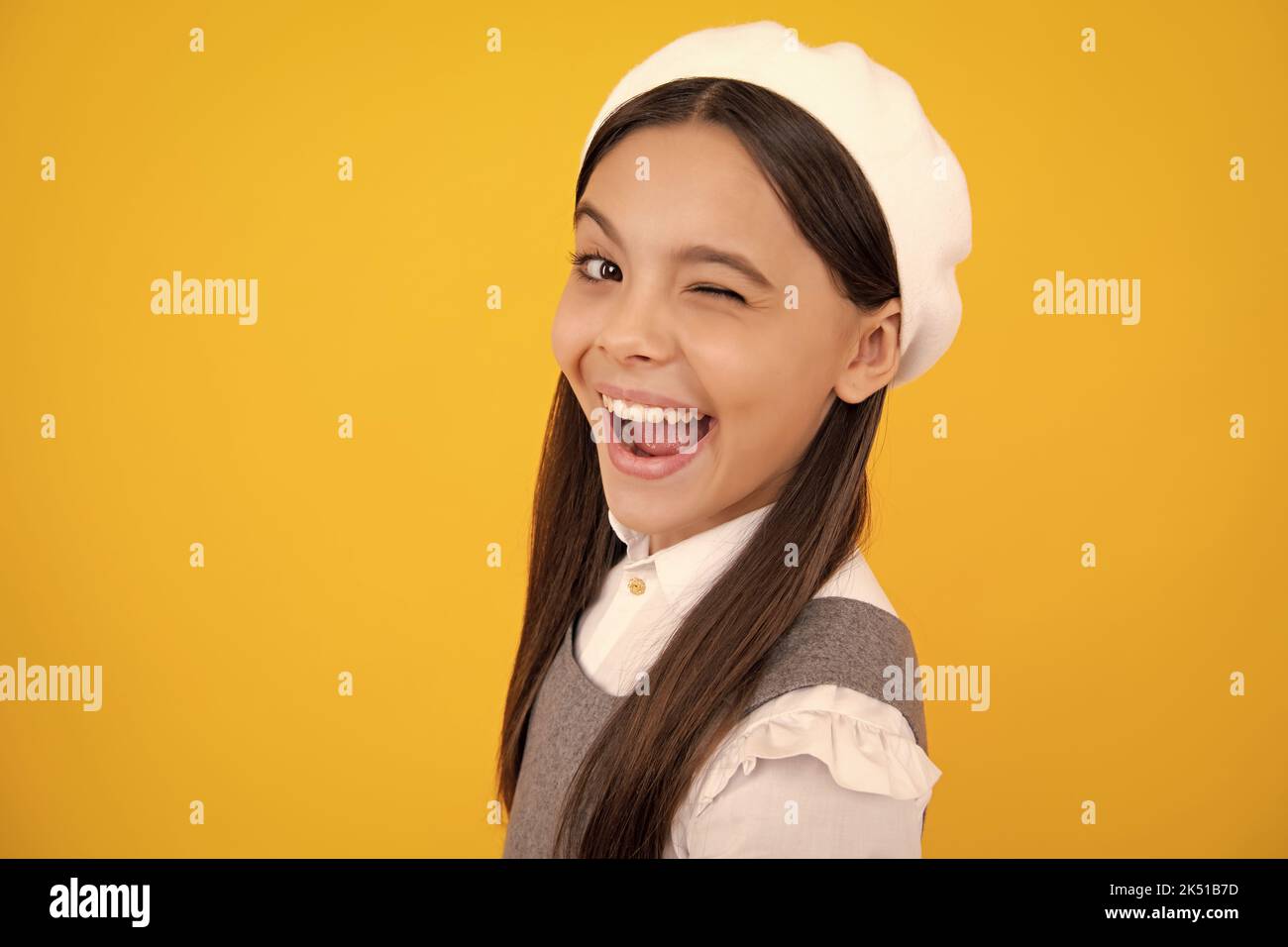 Funny kids winks face. Portrait of funny teenager child girl smiling ...