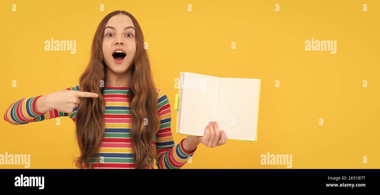 Take a look read a book. Surprised girl point finger at open book. Read ...