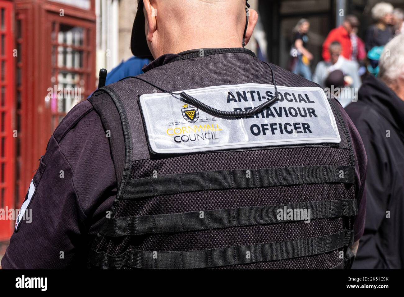 A rear view of a Cornwall Council Anti-social Behaviour Officer on duty ...