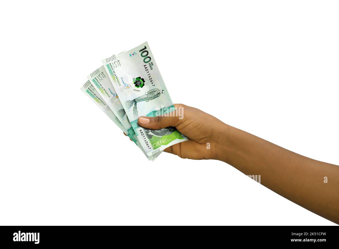 Fair hand holding 3D rendered Colombian peso notes isolated on white ...