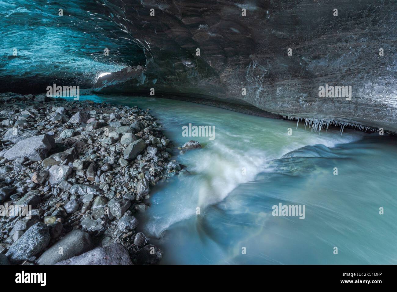 Interior of breathtaking ice cave with wet floor inside Vatnajokull ...