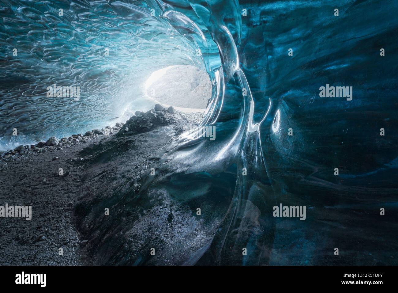 Interior of breathtaking ice cave with wet floor inside Vatnajokull ...