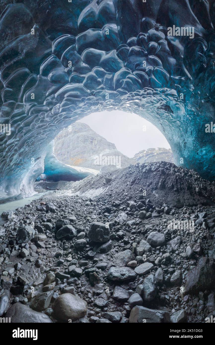 Interior of breathtaking ice cave with wet floor inside Vatnajokull ...