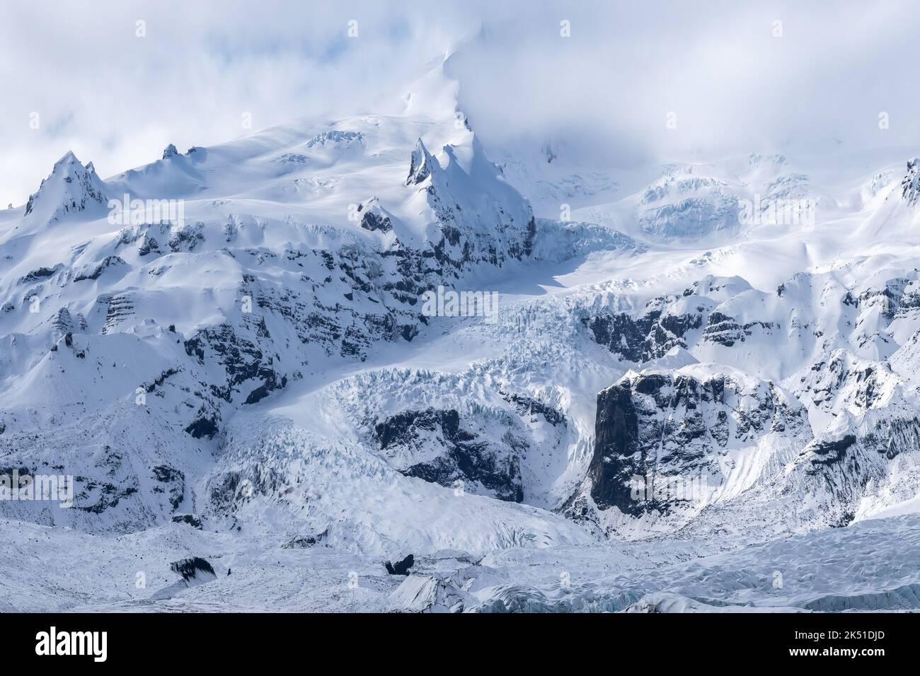 Picturesque scenery of huge rocky mountain range covered with snow ...