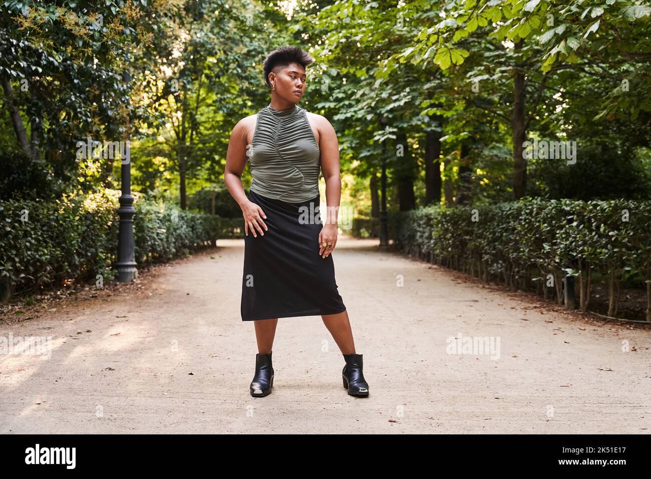 Full body of confident Filipino non binary guy wearing top with black ...