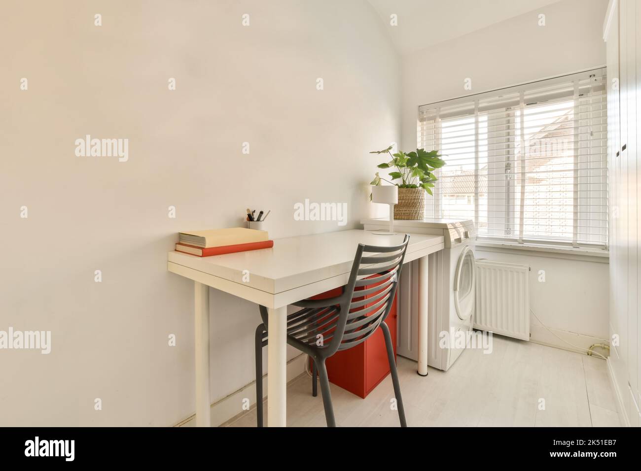 Interior of empty room with whitewash walls and laminated floor in ...